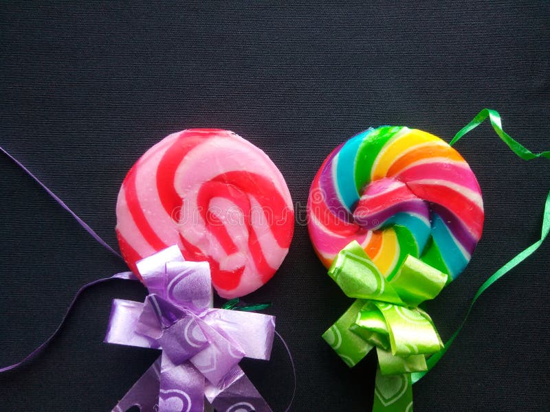 Two Colored Candy with Ribbon Stock Image - Image of icing, petal ...