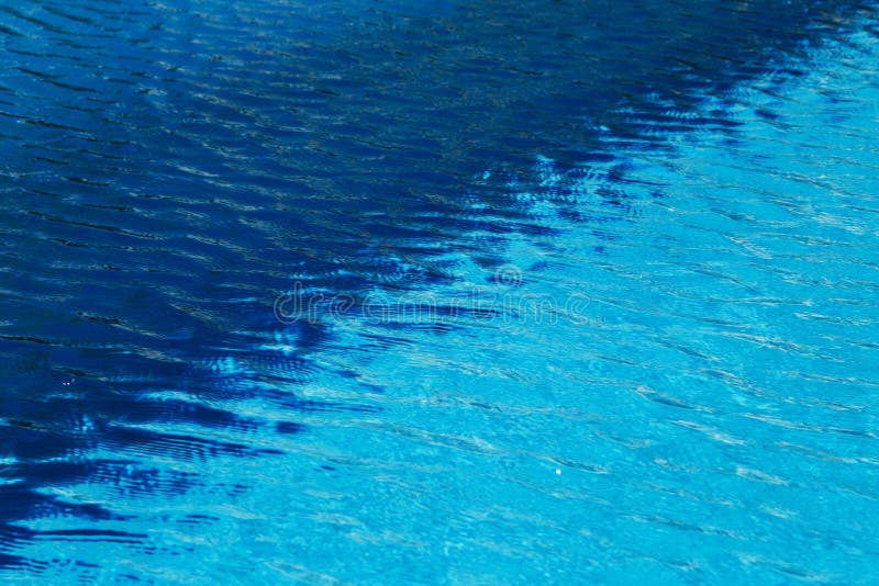 Two Colored Light and Dark Blue Water with Ripples and Sunny ...