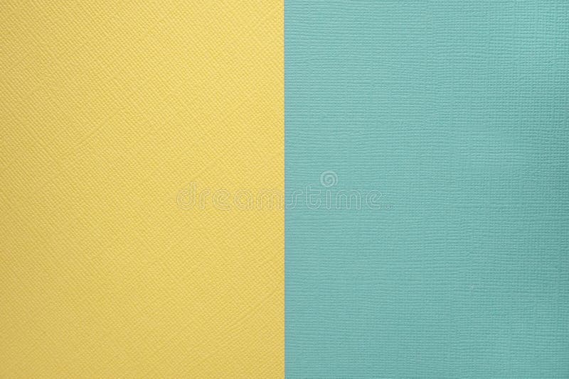 Two Colored Papers with a Blue and Yellow Overlay on the Floor. they ...