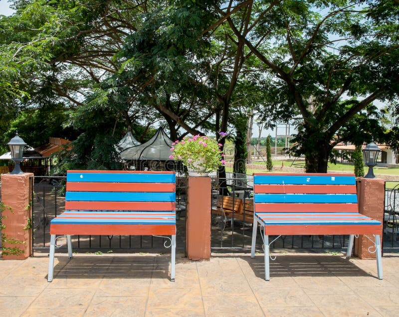 Two colorful metal benches stock photo. Image of grass - 41081814