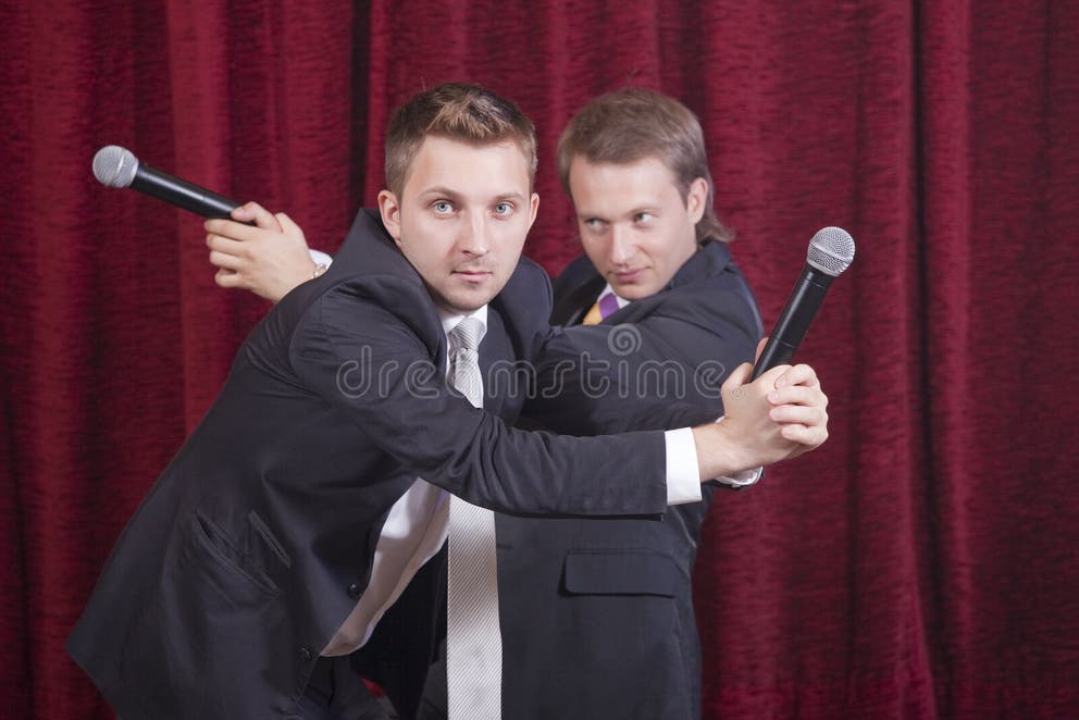 Two Comedians with Microphones Stock Image - Image of show, holding ...
