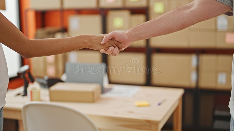 Two Committed Hispanic Workers Share a Hearty Handshake in the Office ...