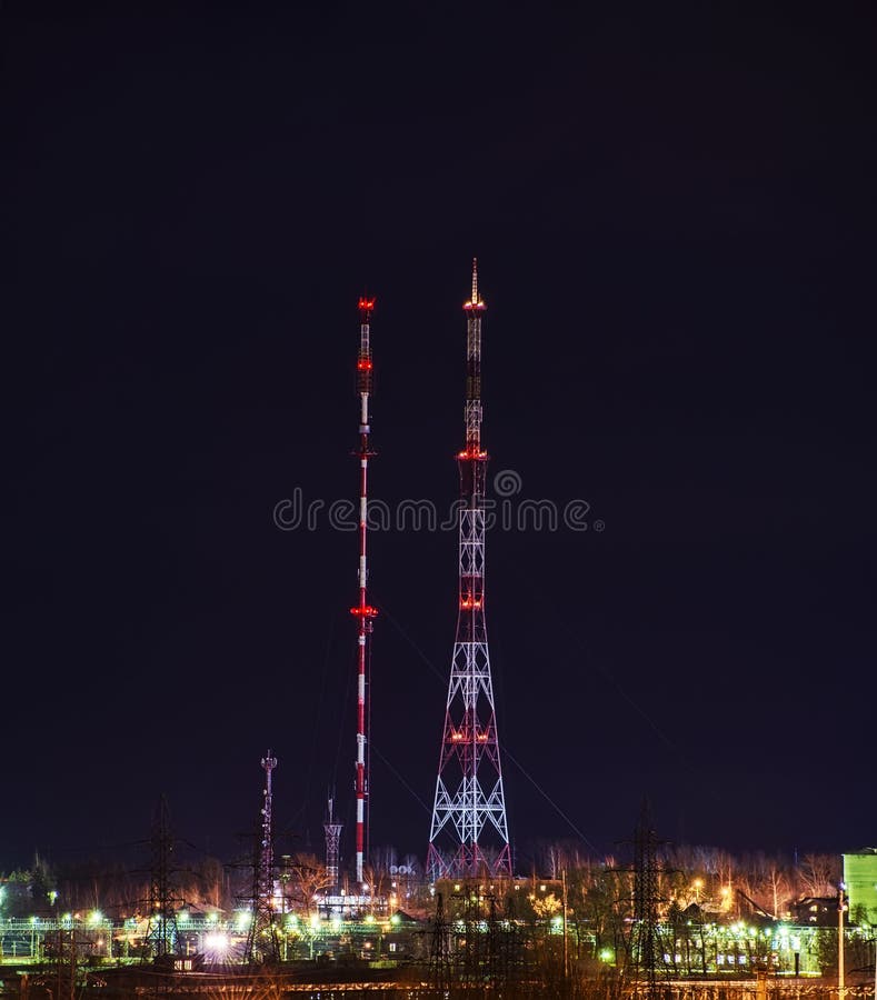Two Communication Towers In The Night Sky Stock Image - Image of blue ...