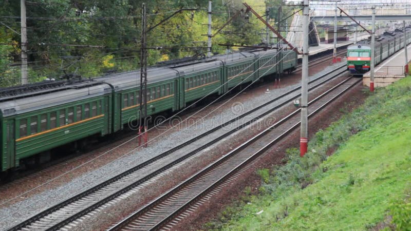 Two Commuter Trains Go with Stations in Different Stock Video - Video ...