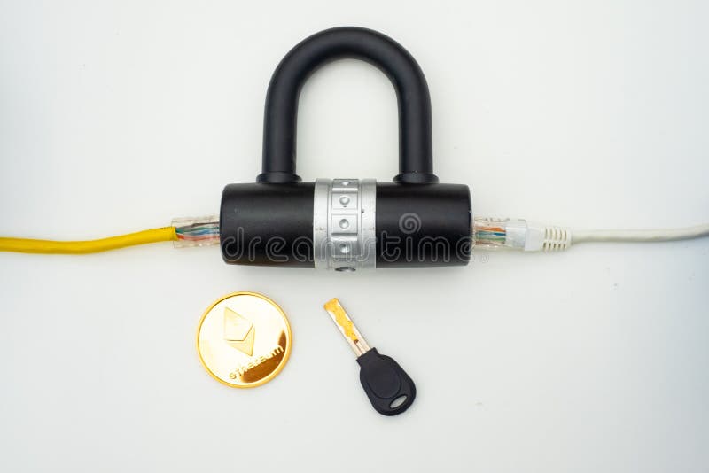 Two Computer Network Cables Going through a Lock with a Key and a ...