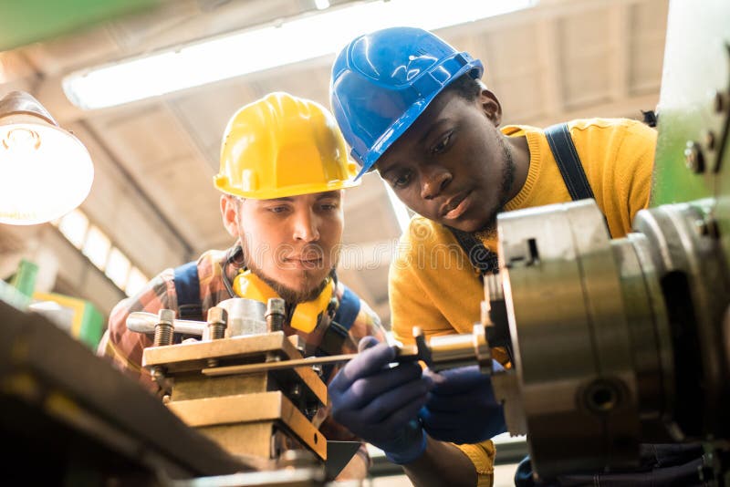 Lathe Operators Working Together Stock Image - Image of gloves, machine ...