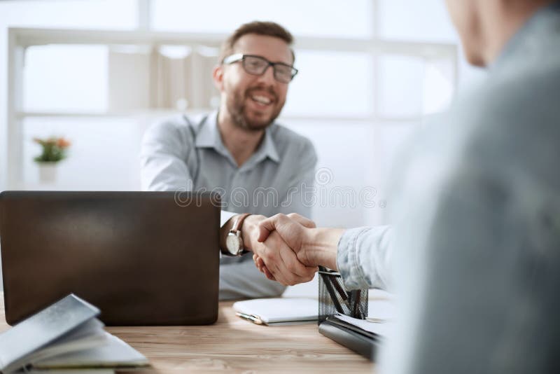 Two Confident Business Men Shaking Hands at the Office Table Stock ...