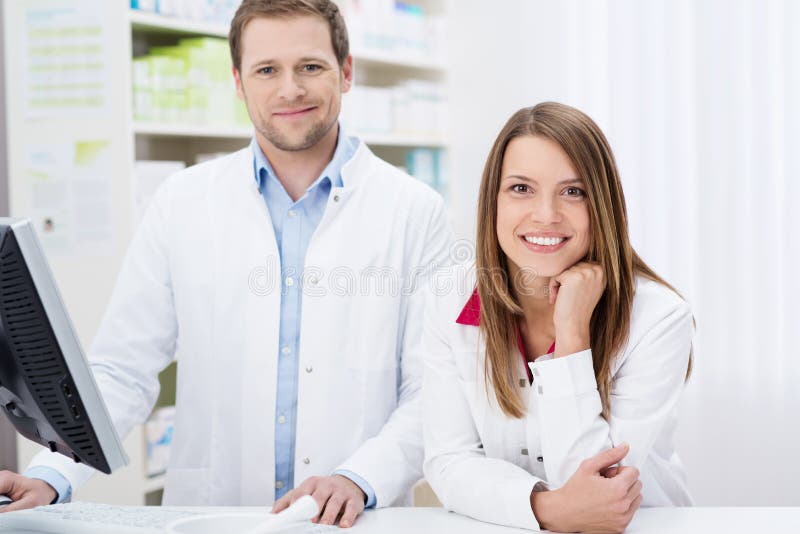 Two Pharmacists in Pharmacy Consulting Stock Image - Image of ...