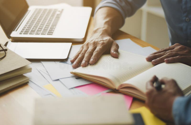 Two Confident Students Doing Homework Together while Sitting at the ...