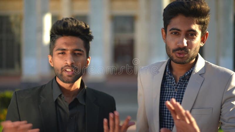 Intelligent Concentrated Middle Eastern Men Talking Standing on City ...