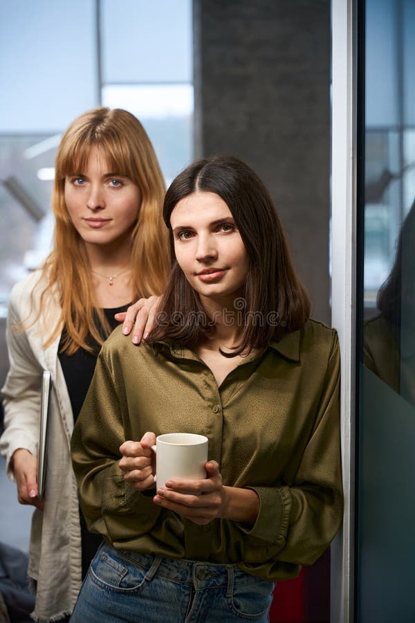 Two Confident Women Clothing Designers Having Break Posing Stock Photo ...