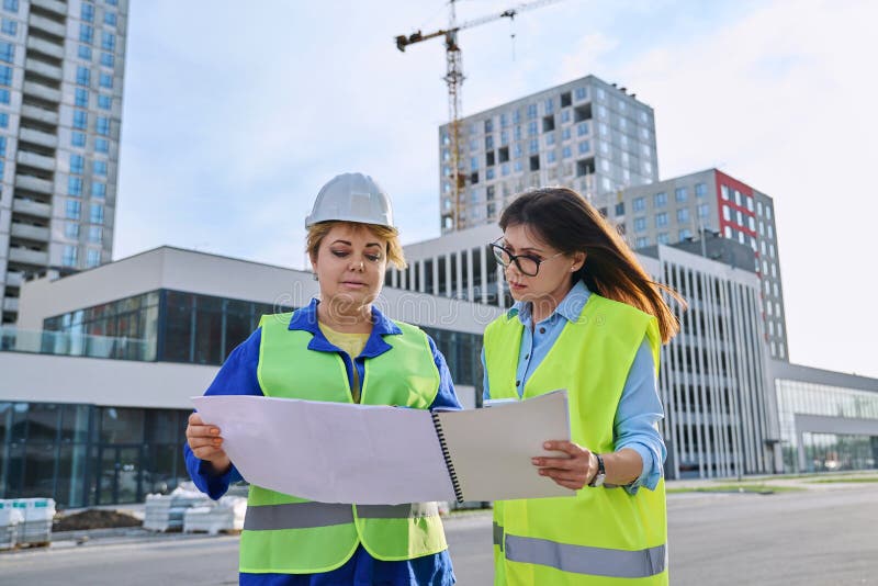 Two Confident Women Talking Working on Construction of Residential ...