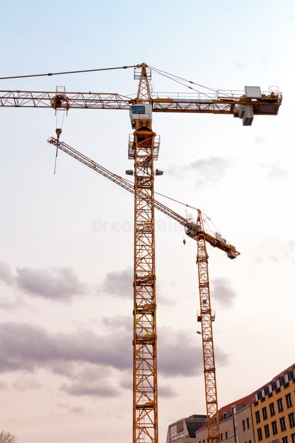 Two construction cranes stock photo. Image of technology - 25366954