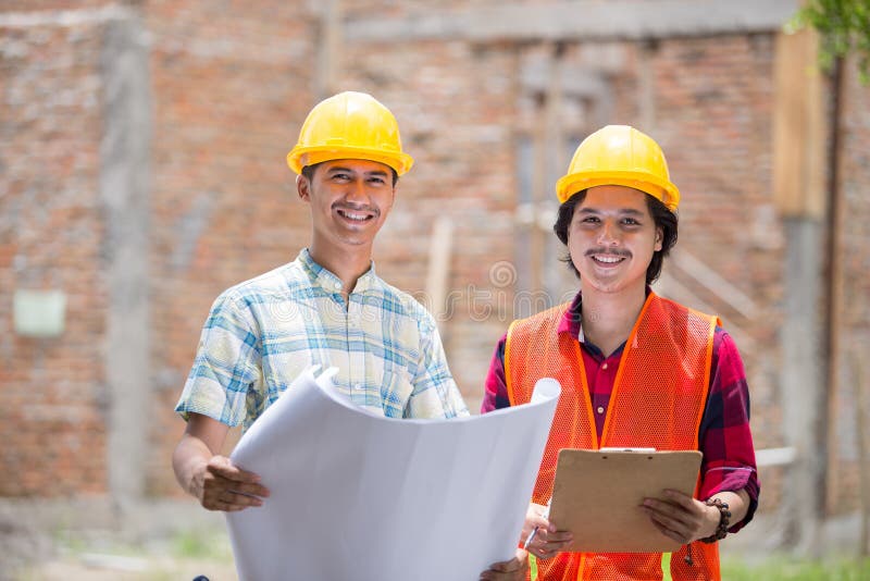 Two Construction Worker Standing in Front of the Building Site Stock ...
