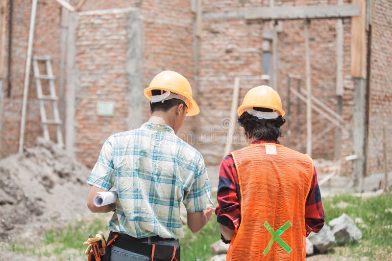 Two Construction Worker Standing in Front of the Building Site Stock ...