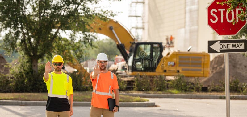 Two Construction Workers in Helmet at Building. Construction Building ...