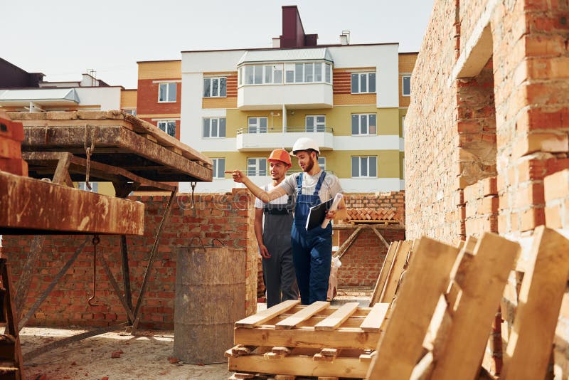 Two Construction Workers is Together at the Building Stock Image ...
