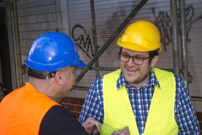 Two construction workers stock image. Image of industrial - 180015949