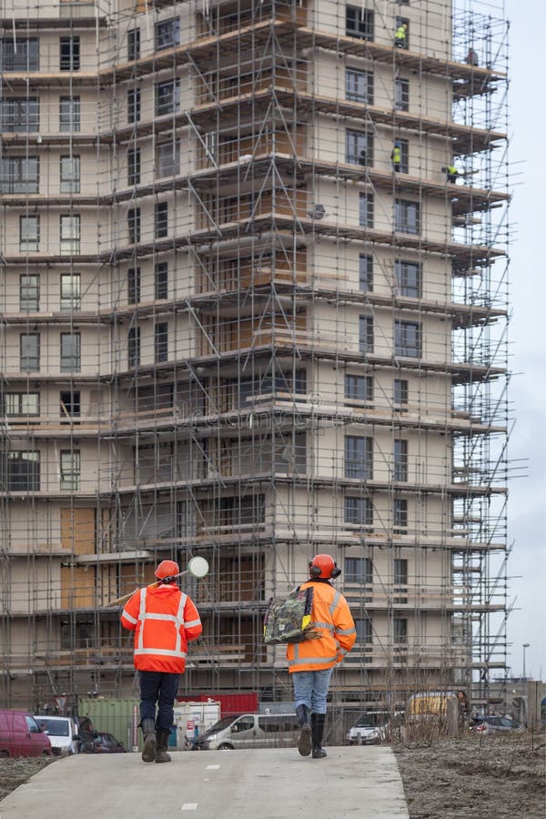 Two Construction Workers Walk To Building Site Stock Photo - Image of ...