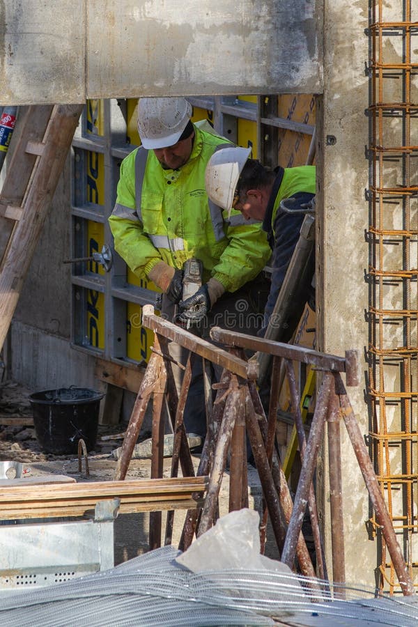 Two Construction Workers are Working with a Drill Bit Editorial Stock ...