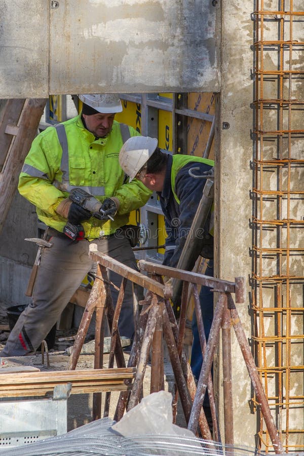 Two Construction Workers are Working with a Drill Bit Editorial Stock ...