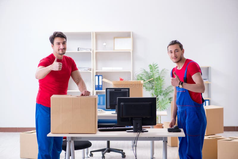 The Two Contractor Employees Moving Personal Belongings Stock Image ...