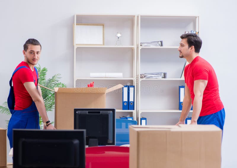 Two Contractor Employees Moving Personal Belongings Stock Image - Image ...