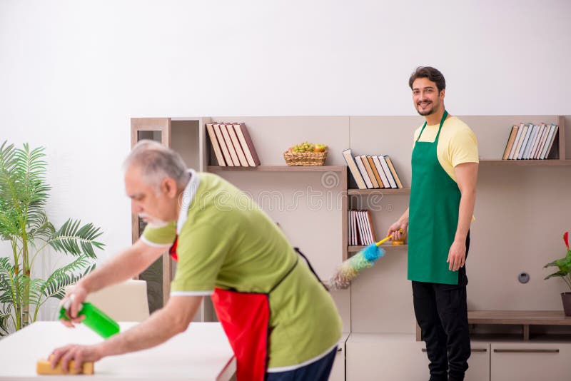Two Male Contractors Cleaning the House Stock Photo - Image of father ...