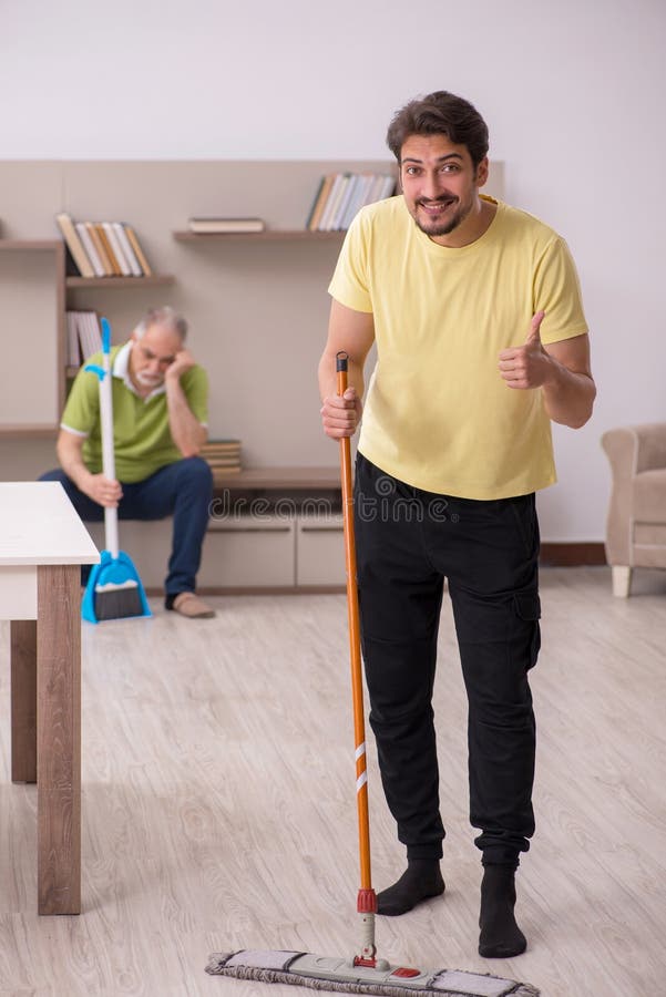 Two Male Contractors Cleaning the House Stock Image - Image of janitor ...