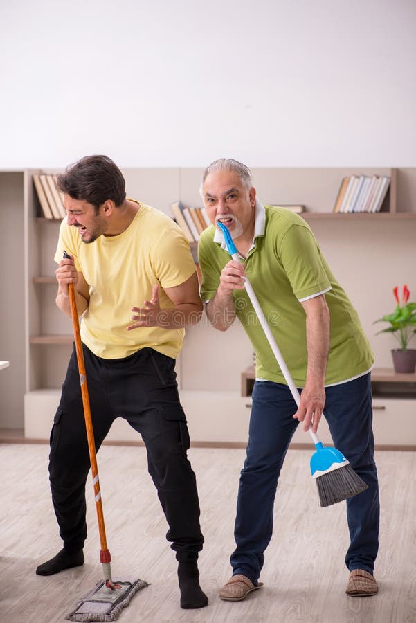 Two Male Contractors Cleaning the House Stock Photo - Image of clean ...
