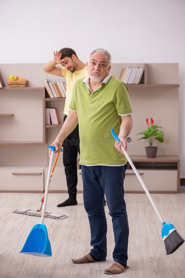 Two Male Contractors Cleaning the House Stock Image - Image of ...