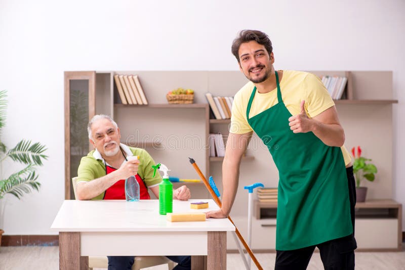 Two Male Contractors Cleaning the House Stock Image - Image of routine ...