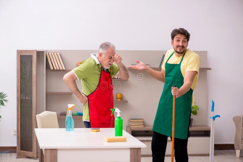 Two Male Contractors Cleaning the House Stock Image - Image of domestic ...