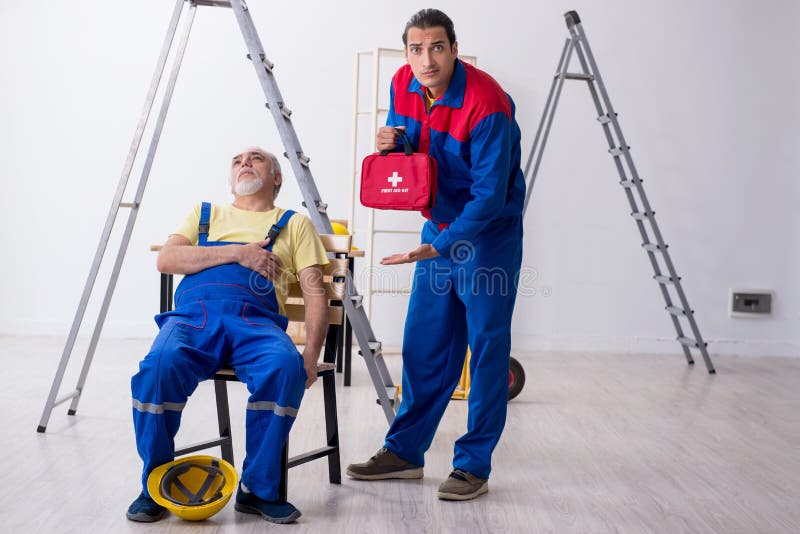 Two Contractors in First Aid Concept Stock Photo - Image of building ...