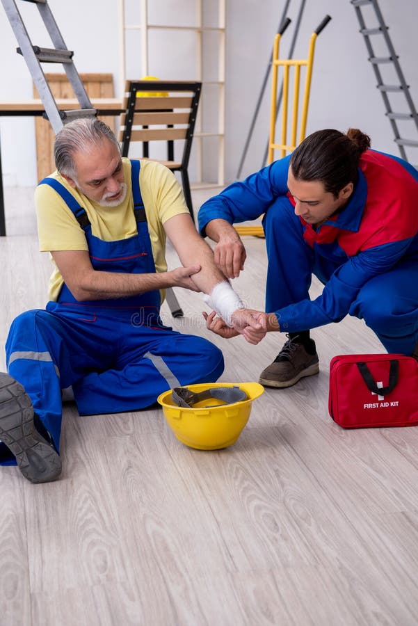 Two Contractors in First Aid Concept Stock Photo - Image of builder ...