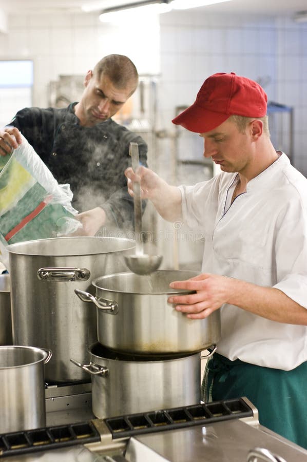 Two Cooks Industrial Kitchen Stock Photo - Image of people, mass: 9449092