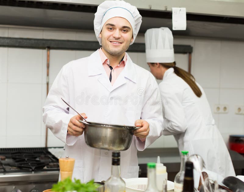 Two Cooks at Restaurant Kitchen Stock Photo - Image of partners ...