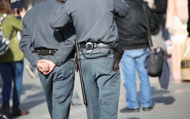 Two cops with handcuffs stock image. Image of patrolman - 139397323