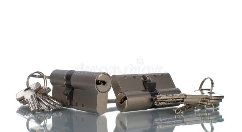 Cores of Locks with Keys, Close-up Isolated on White. Stock Photo ...