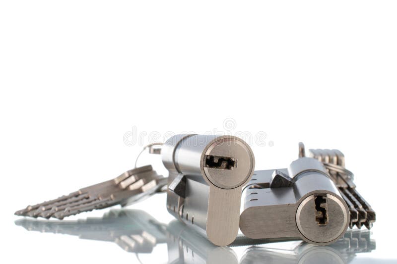 Cores of Locks with Keys, Close-up Isolated on White. Stock Image ...