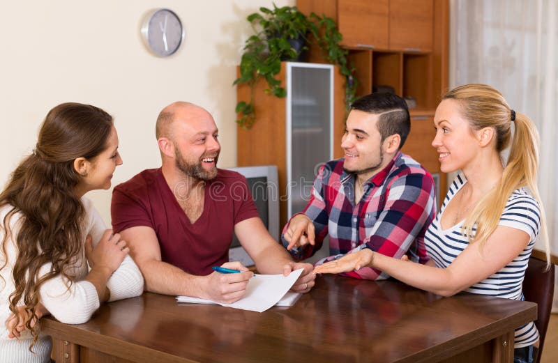 Two Couples Discussing and Smiling Stock Image - Image of contract ...