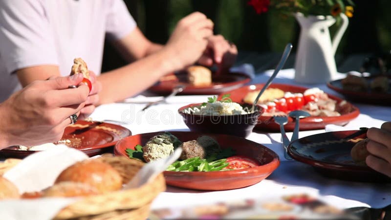Cold Cuts Board with Grapes Cheese and Seasoning on Dining Table Stock ...