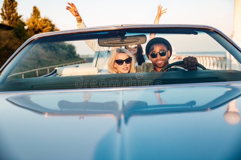 Two Couples with Raised Hands in the Car Stock Image - Image of human ...