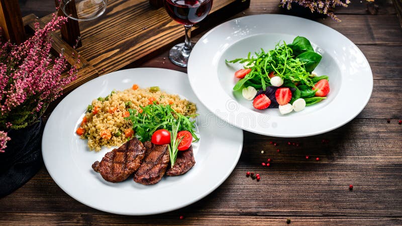 Two Course Lunch Grilled Meat and Fresh Vegetable Salad on the Table ...