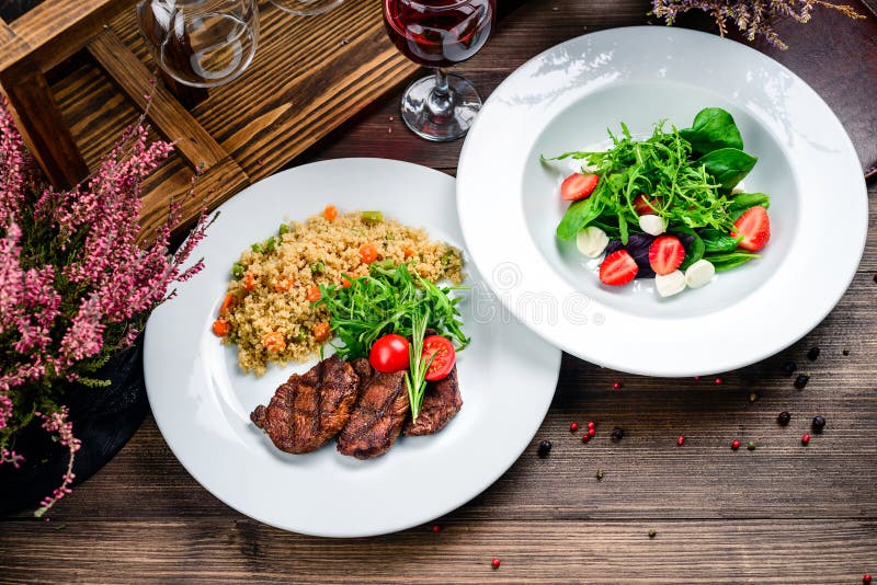 Two Course Lunch Grilled Meat and Fresh Vegetable Salad on the Table ...