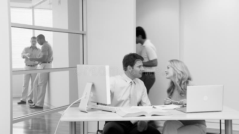 Two Coworkers at Desk in Busy Office Stock Footage - Video of confident ...
