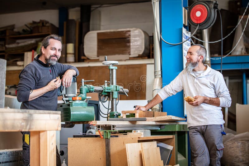 Two Craftsmen are Taking a Break in a Workshop Stock Image - Image of ...