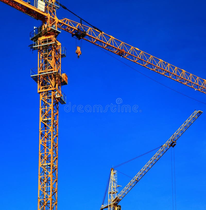 Two cranes stock photo. Image of outdoors, industry, yellow - 17983238