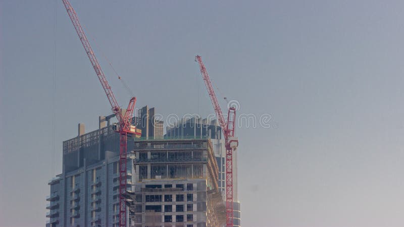 Two Cranes Working on Constraction Site Works of New Skyscraper ...
