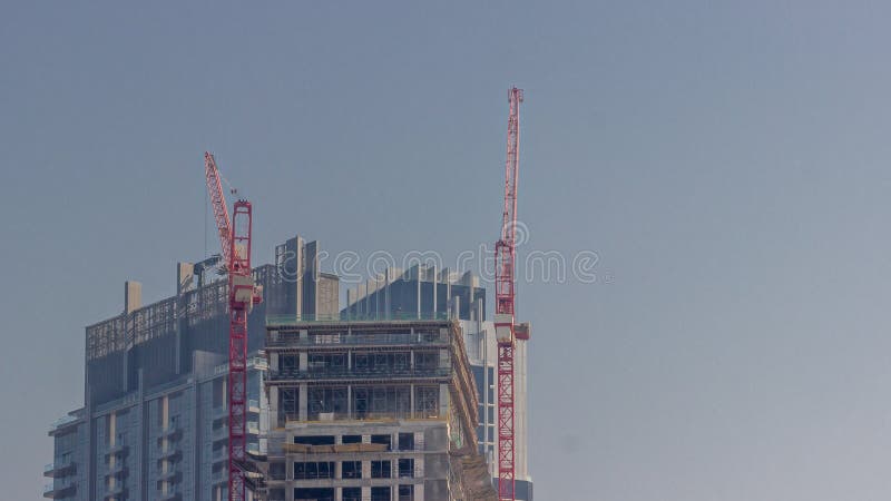 Two Cranes Working on Constraction Site Works of New Skyscraper ...